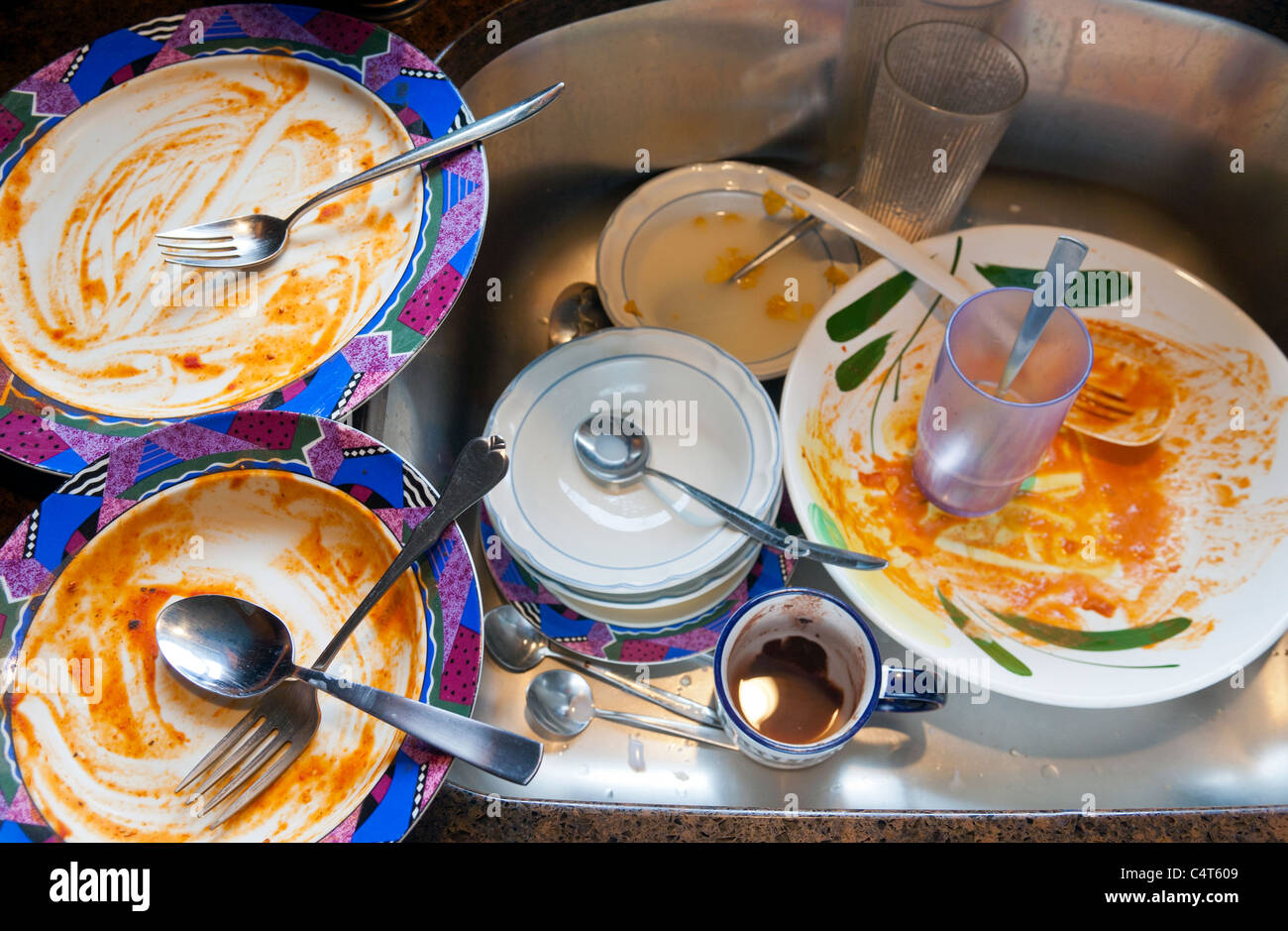 Dirty dishes in kitchen sink Stock Photo - Alamy