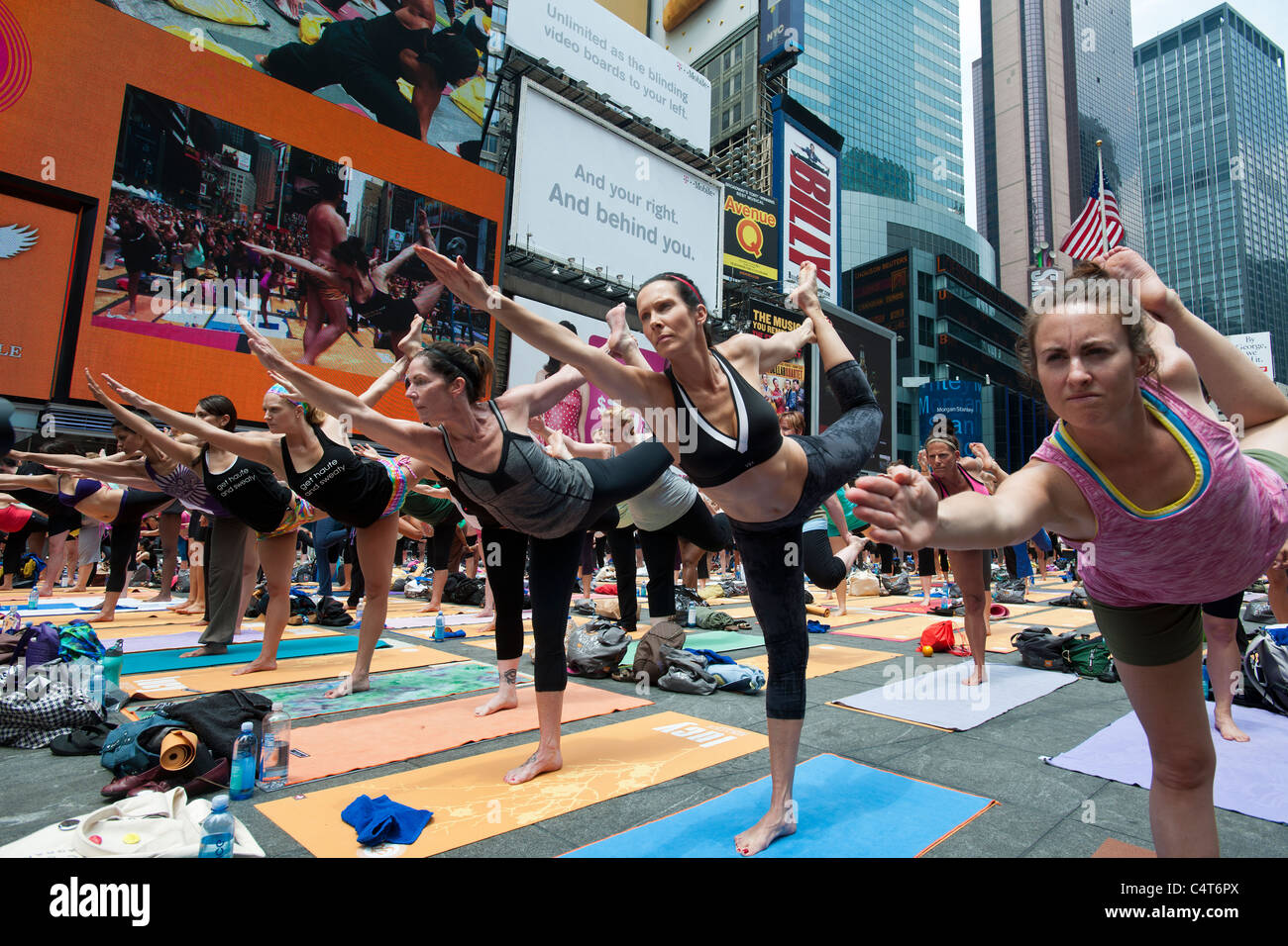 Thousands of yoga practitioners in Times Square in New York participate ...