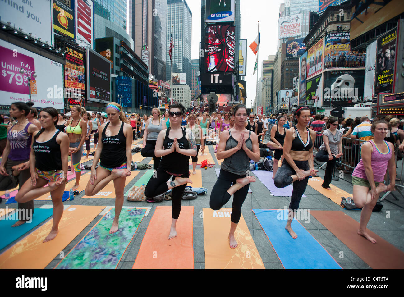 Thousands of yoga practitioners in Times Square in New York participate ...