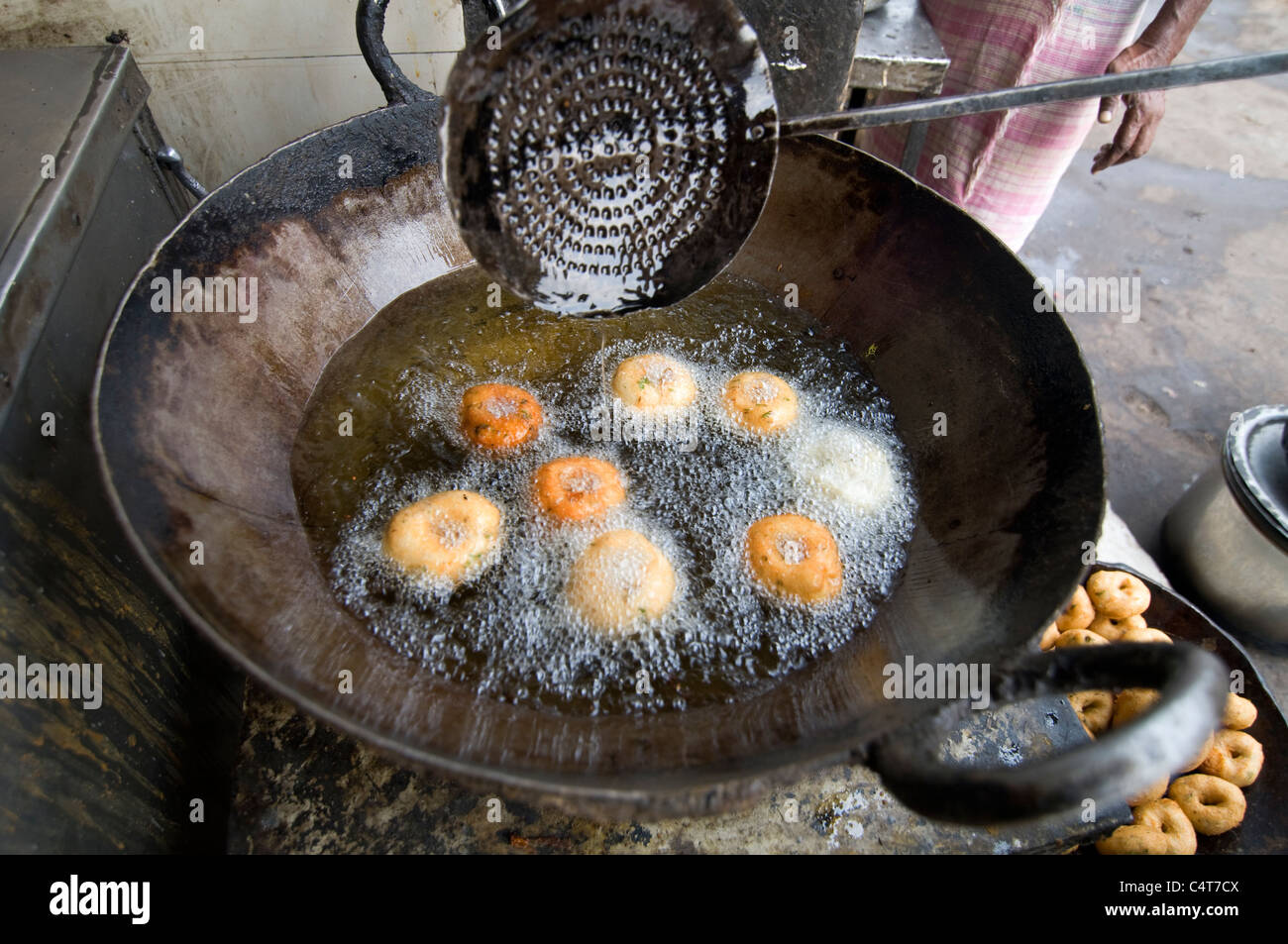 Deep fried street food is commonly eaten throughout India Stock Photo ...