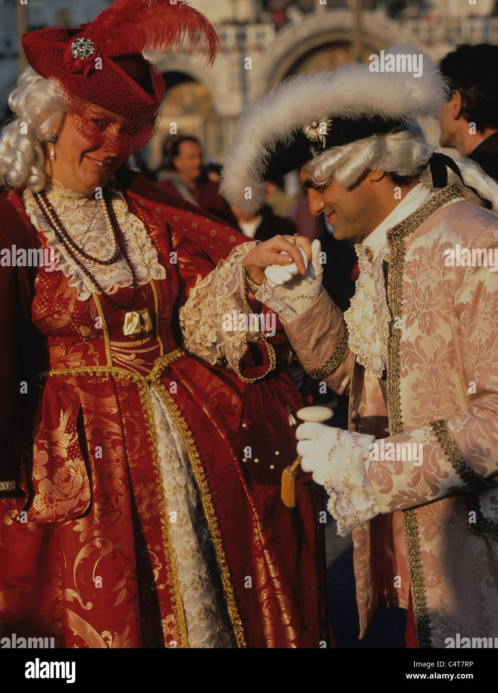 A couple masquerading in St Mark's Square Stock Photo - Alamy