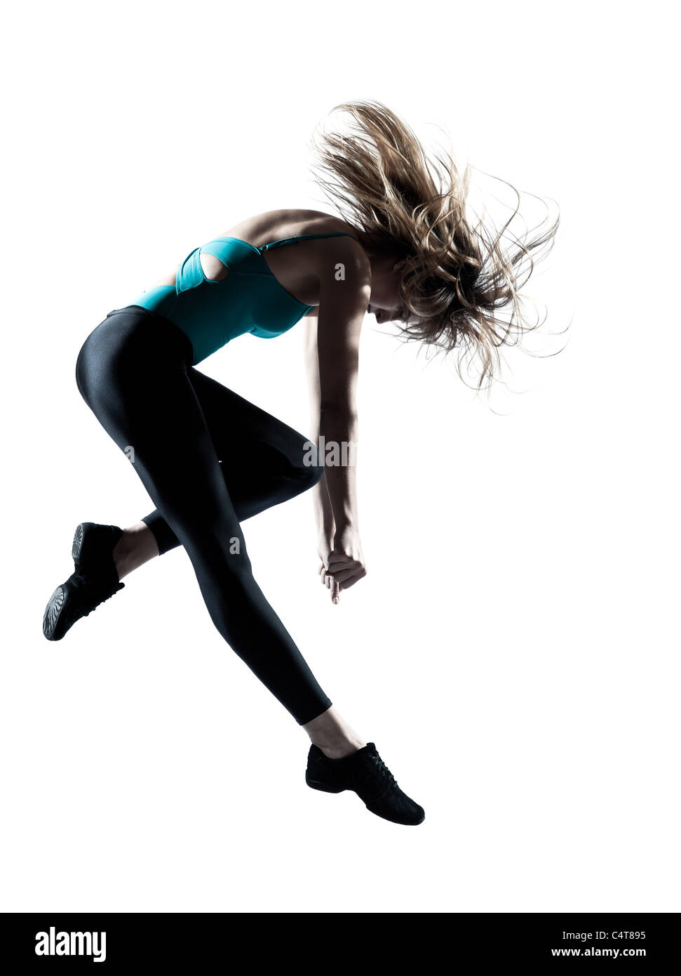 Side view of an energetic female doing aerobics isolated on white ...