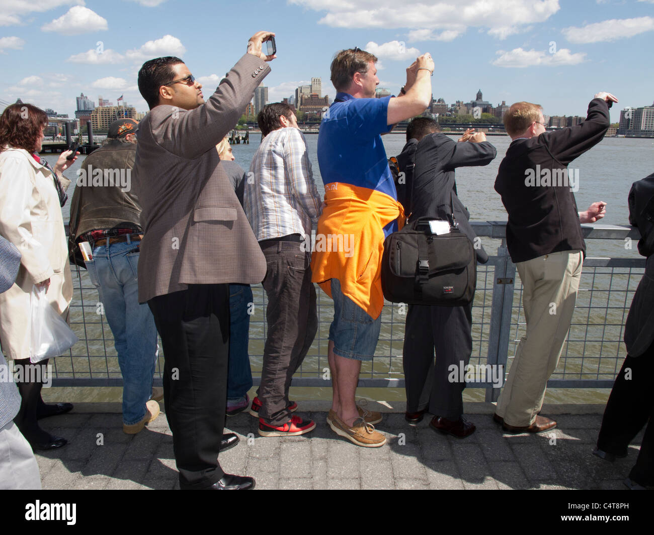 Spectators snap photos of Marine One awaiting the arrival of President ...