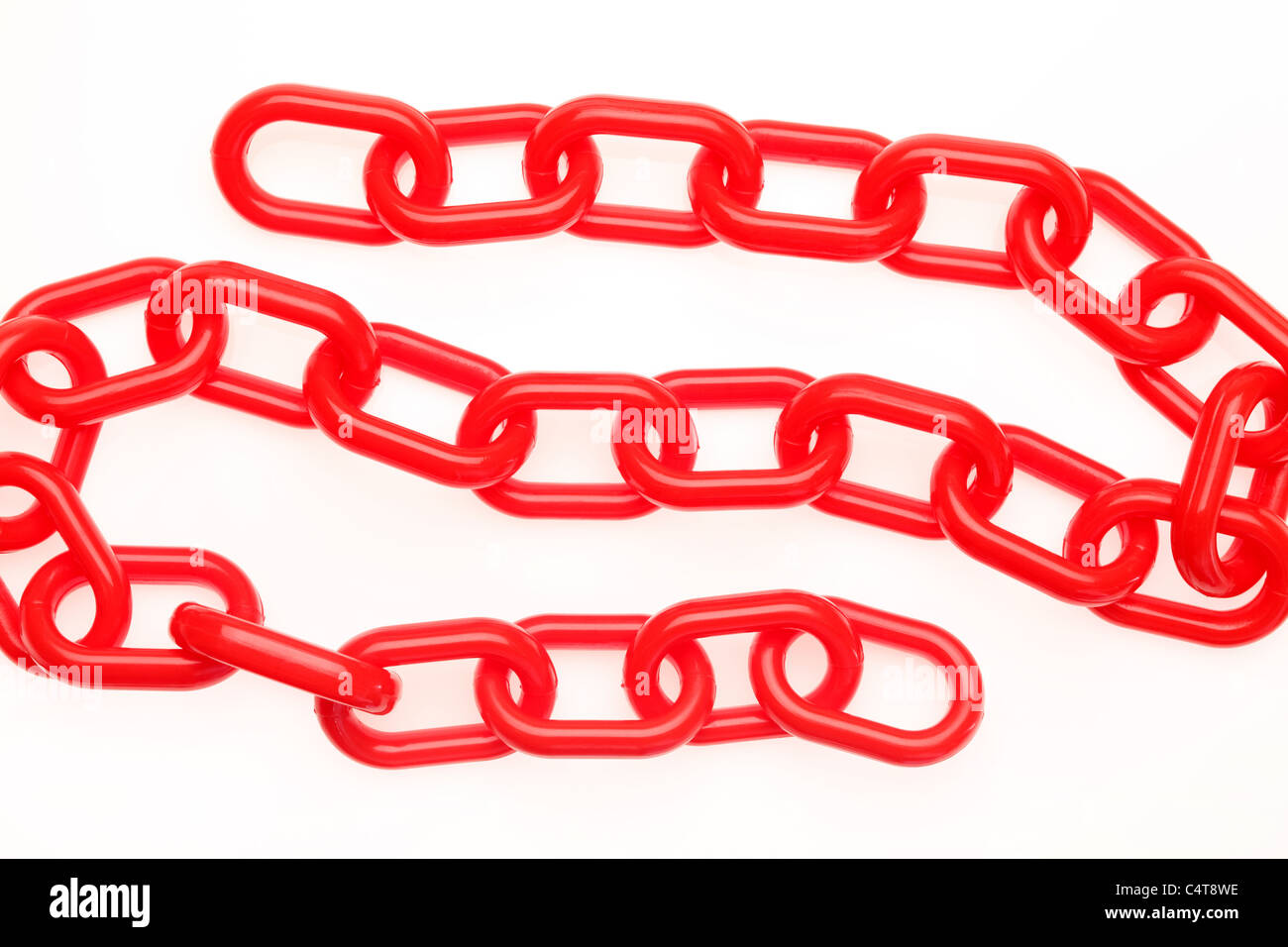 Red plastic chain on a white background Stock Photo - Alamy