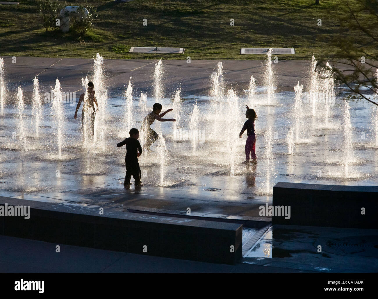 Children playing in water fountain park hi-res stock photography and ...