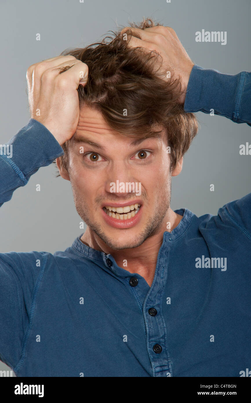 Man with Hands on Head Stock Photo - Alamy