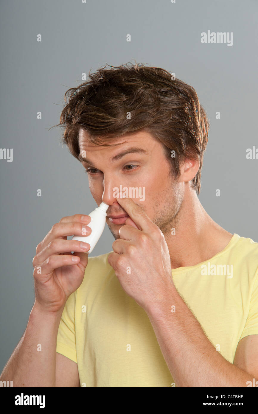 Man Using Nasal Spray Stock Photo - Alamy