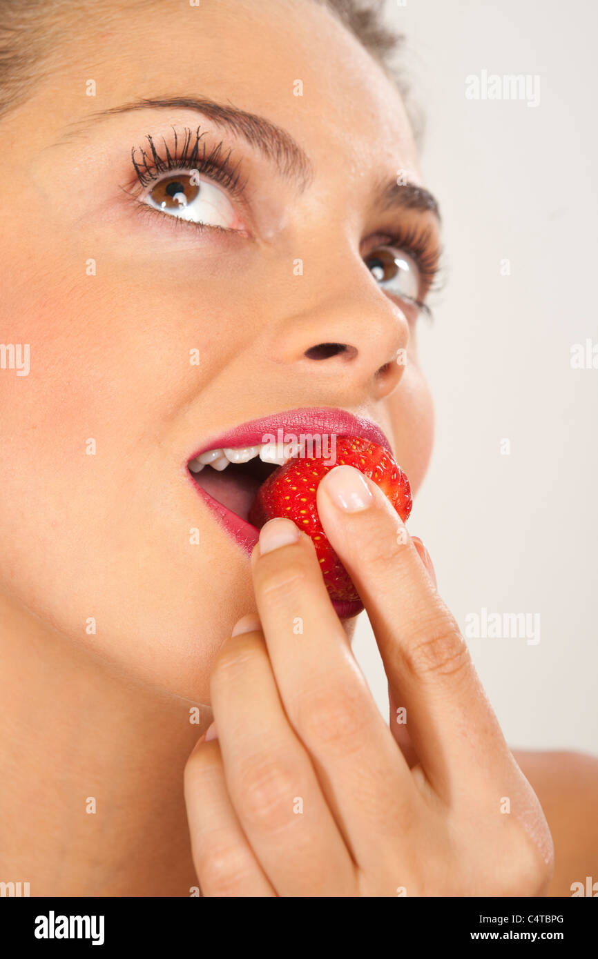 Woman Eating Strawberry Stock Photo - Alamy