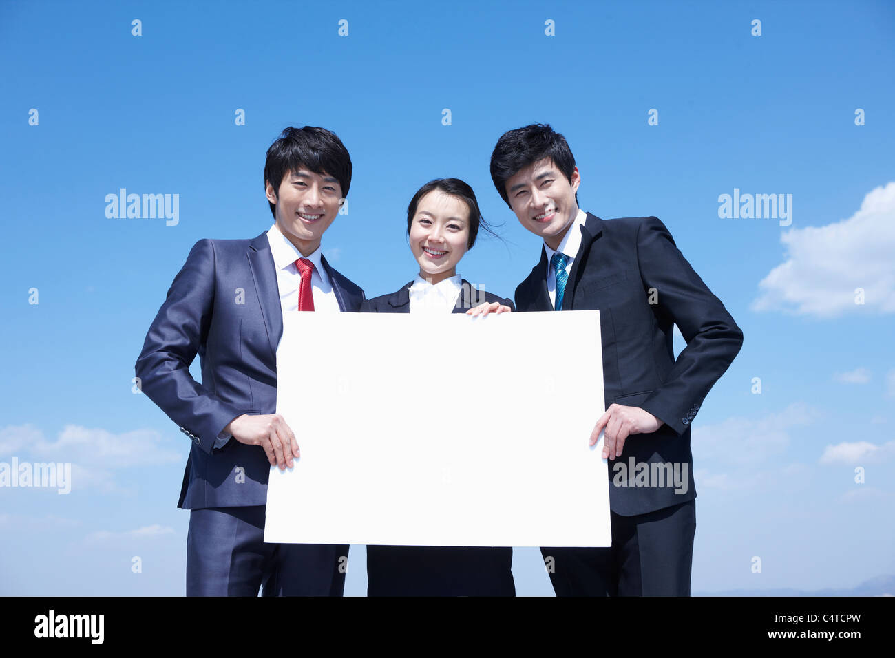 businessmen holding panels Stock Photo - Alamy