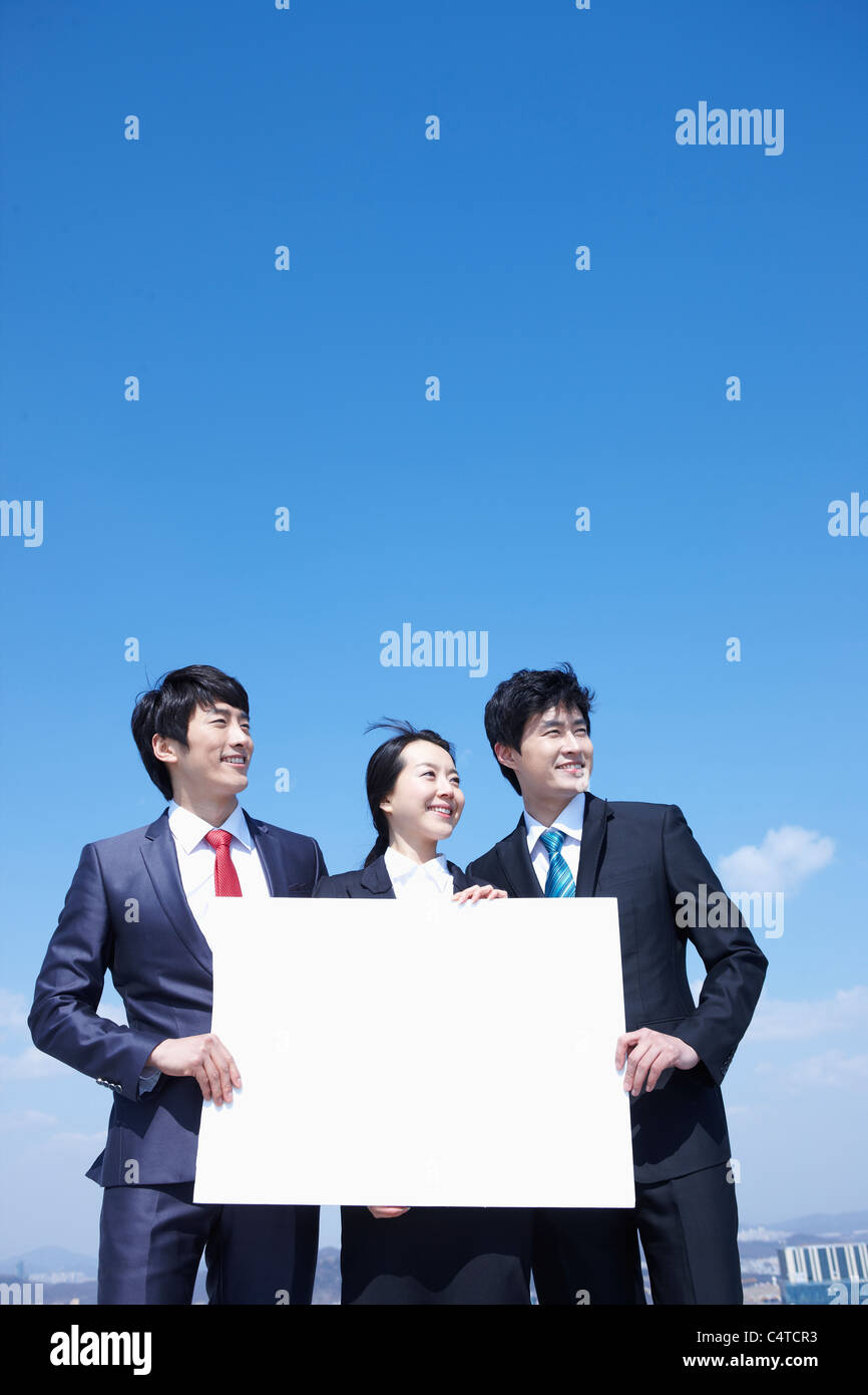 businessmen holding panels Stock Photo - Alamy