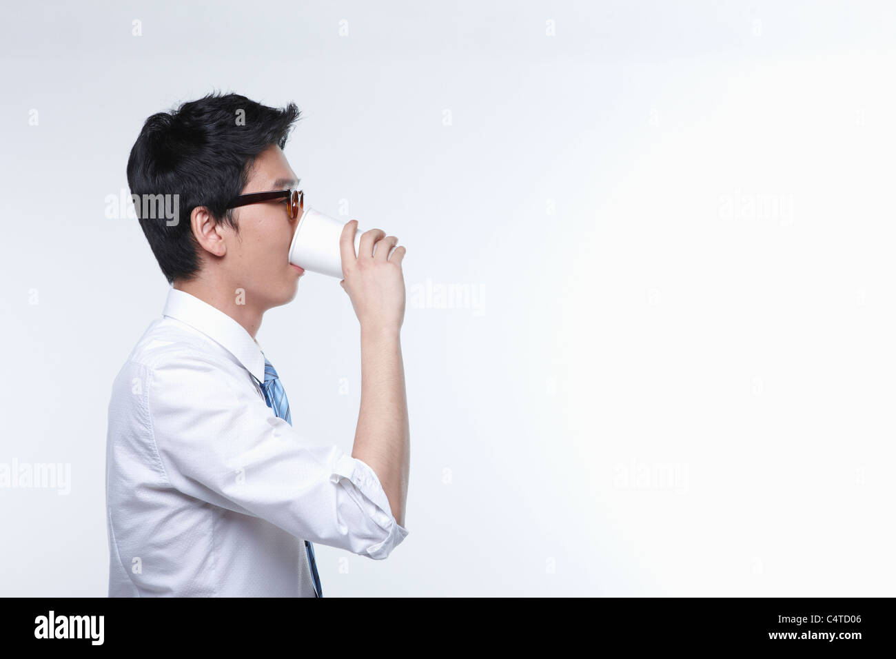 business man is drinking something Stock Photo - Alamy
