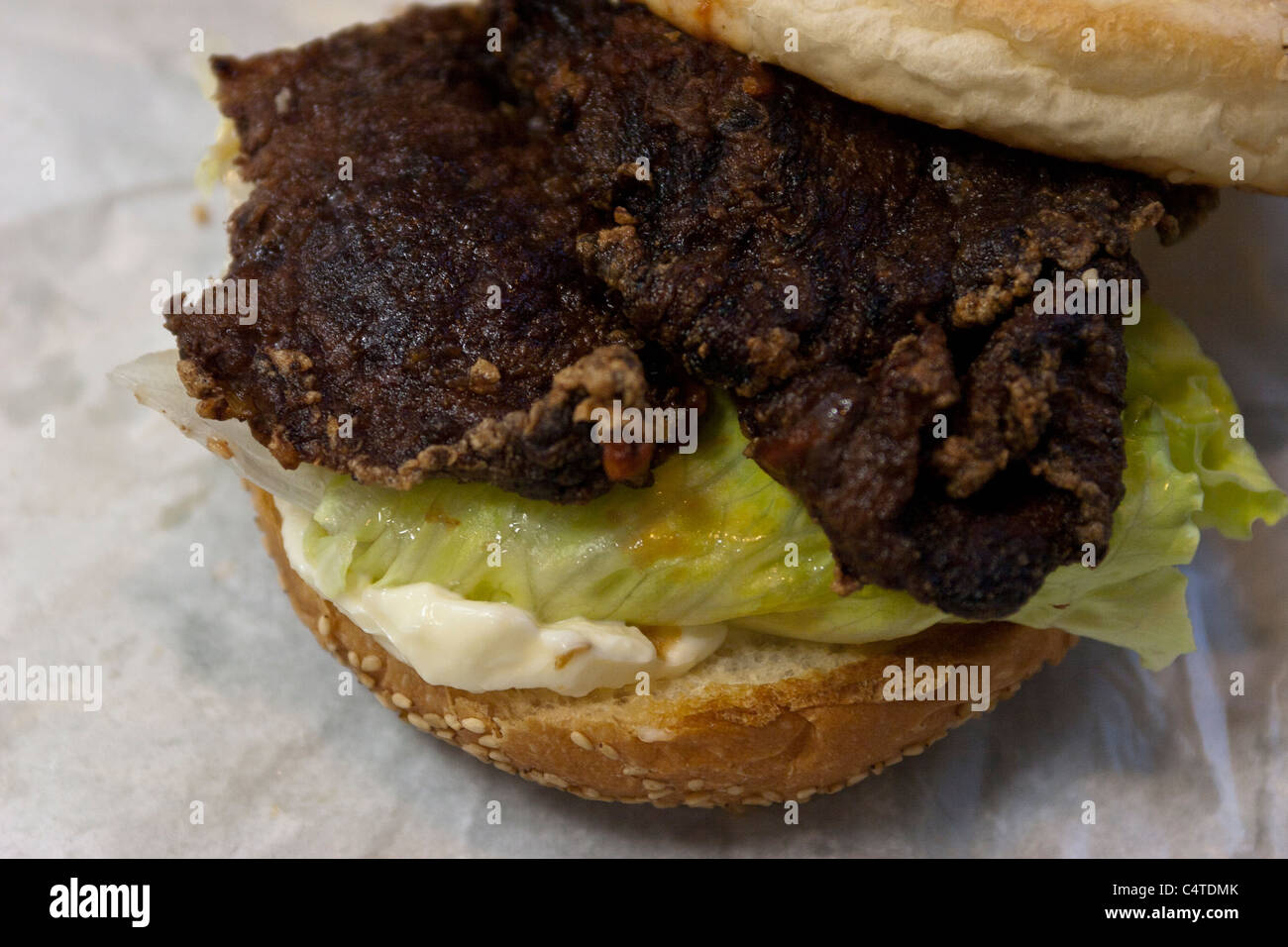 A whale meat burger at the Lucky Pierrot burger shop in Hakodate ...