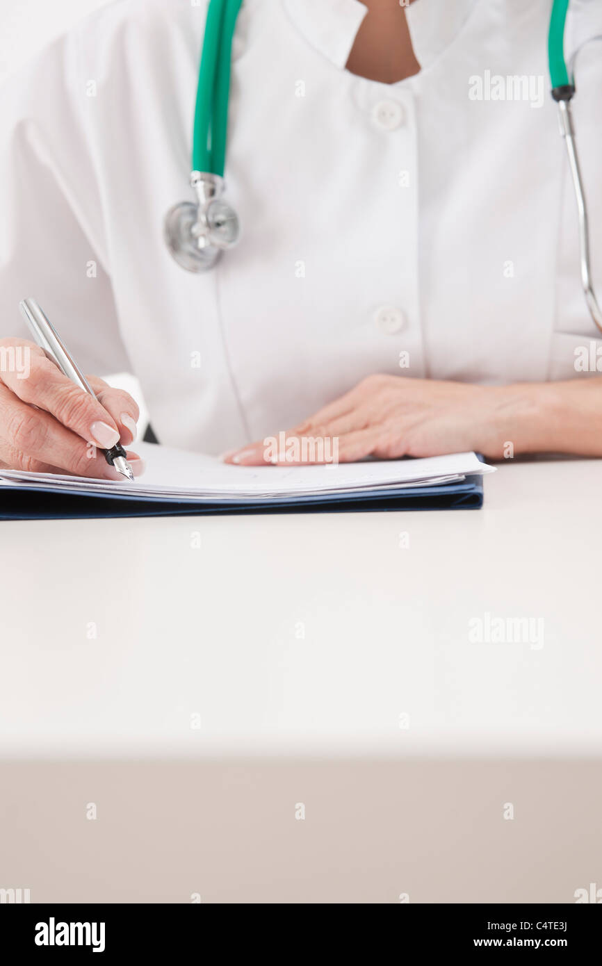 Doctor Writing Notes Stock Photo - Alamy