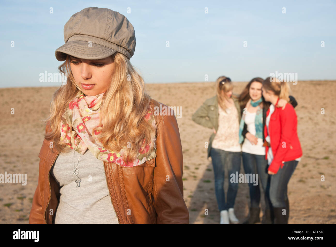 Teen girl left out by friends hi-res stock photography and images - Alamy