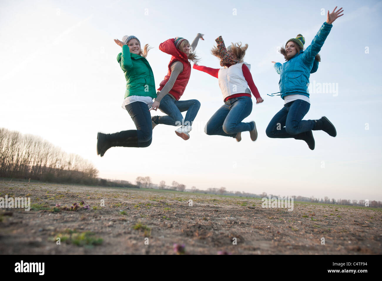 Teenagers Jumping in the Air Stock Photo - Alamy