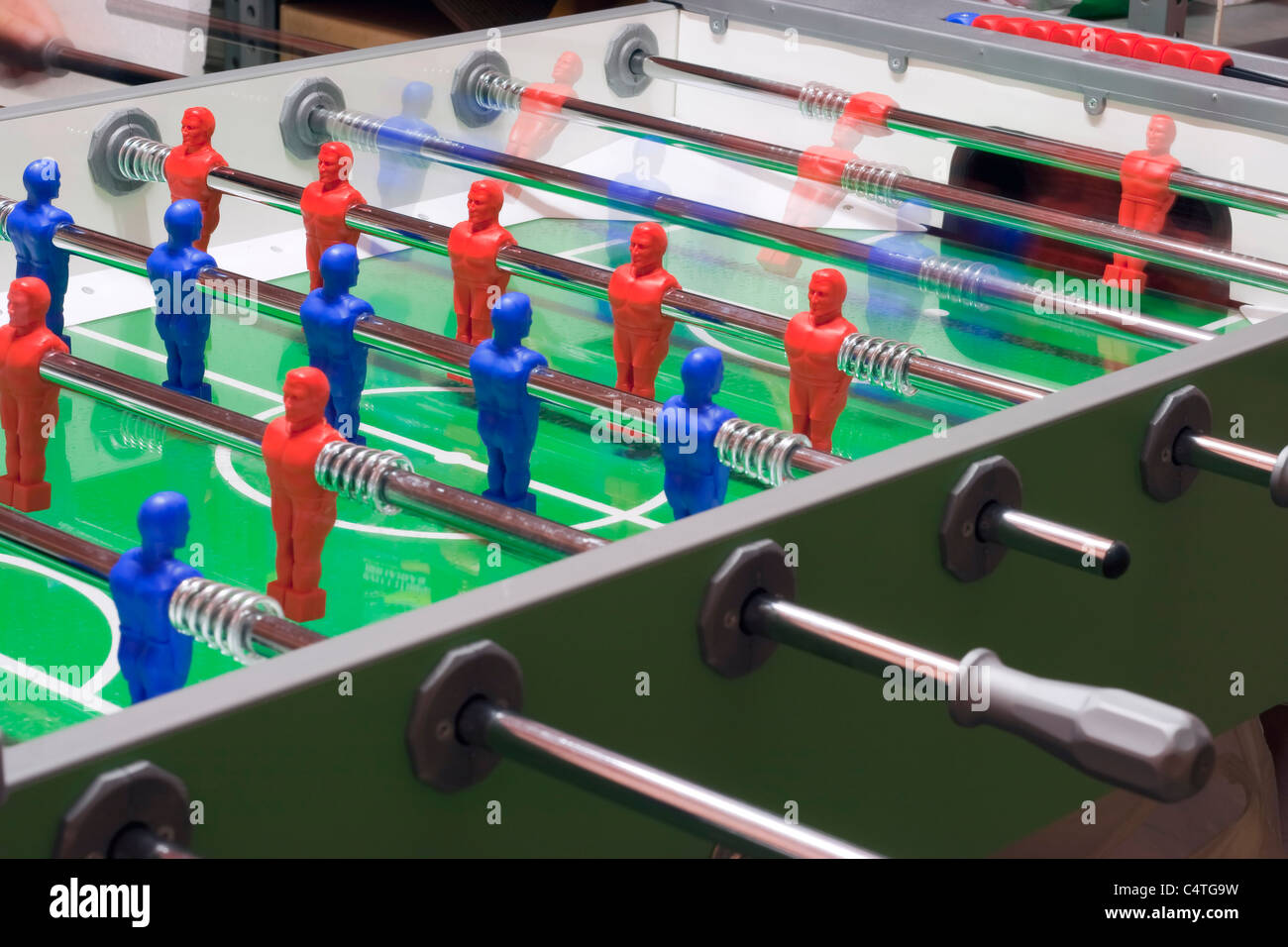 football table game ,red and blue player during a game Stock Photo - Alamy