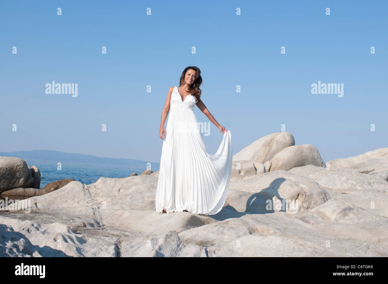 Woman on Rocks Stock Photo - Alamy