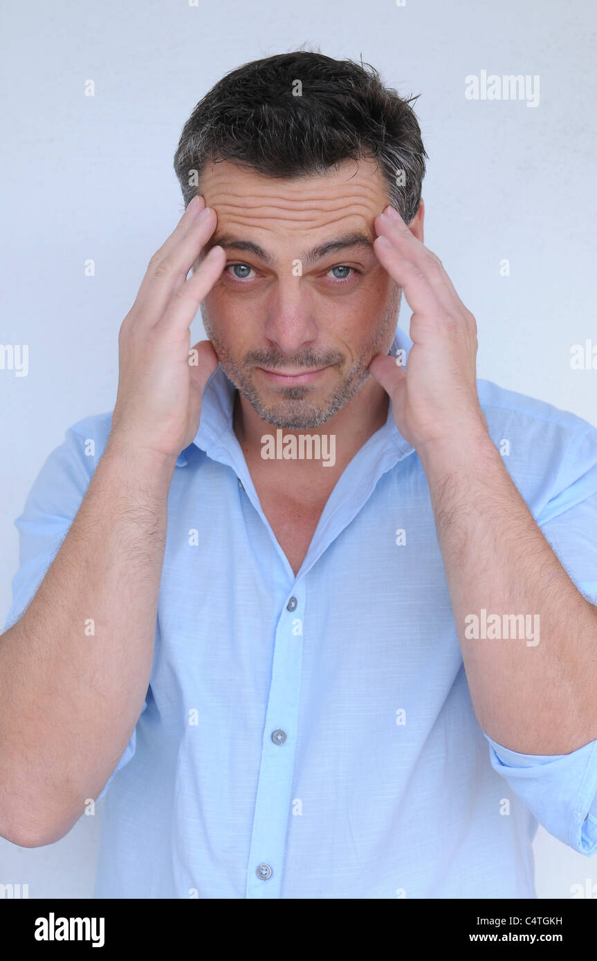 Man with Hands on Head Stock Photo - Alamy