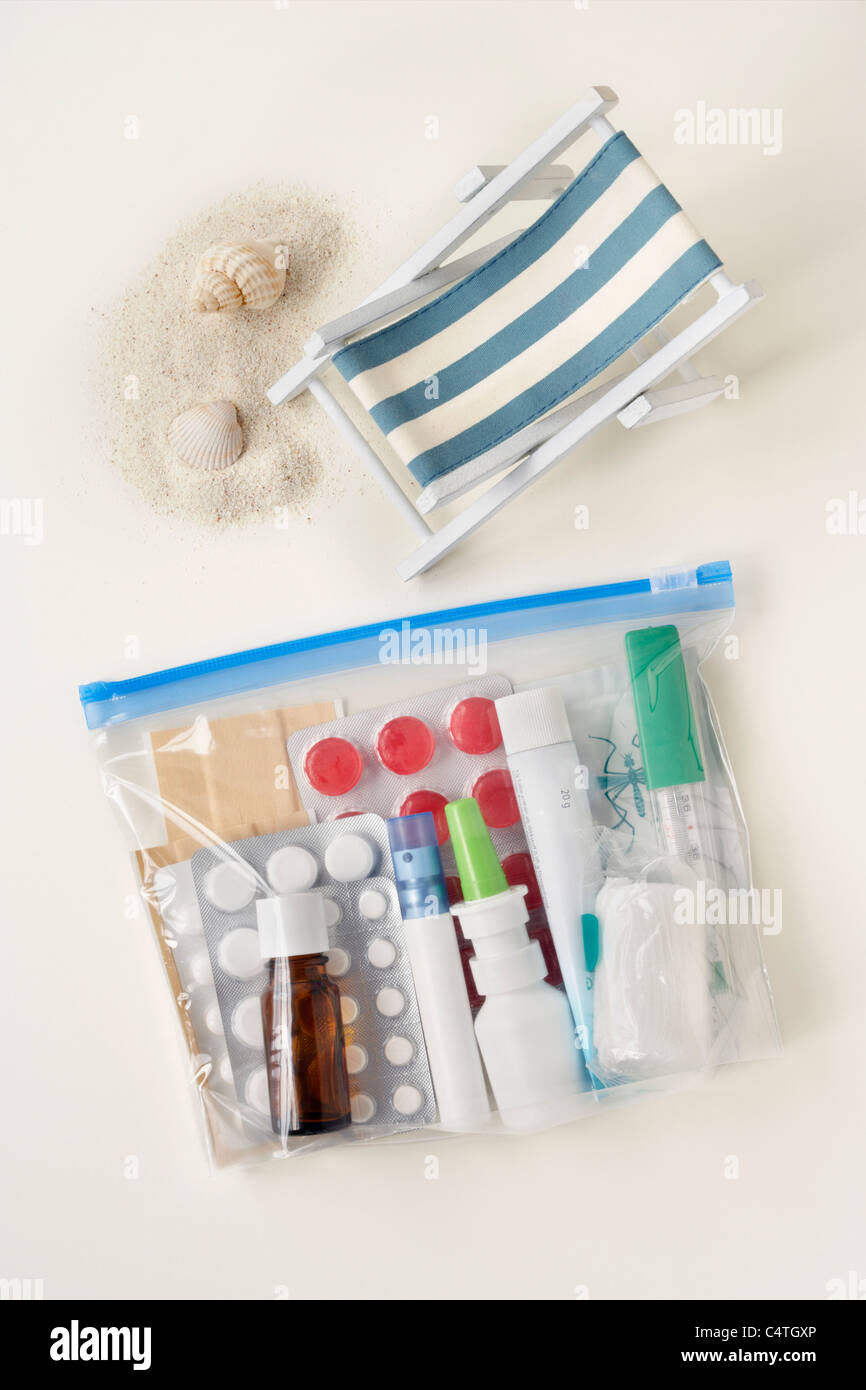 First Aid Travel Kit Beach Chair and Sand Stock Photo - Alamy