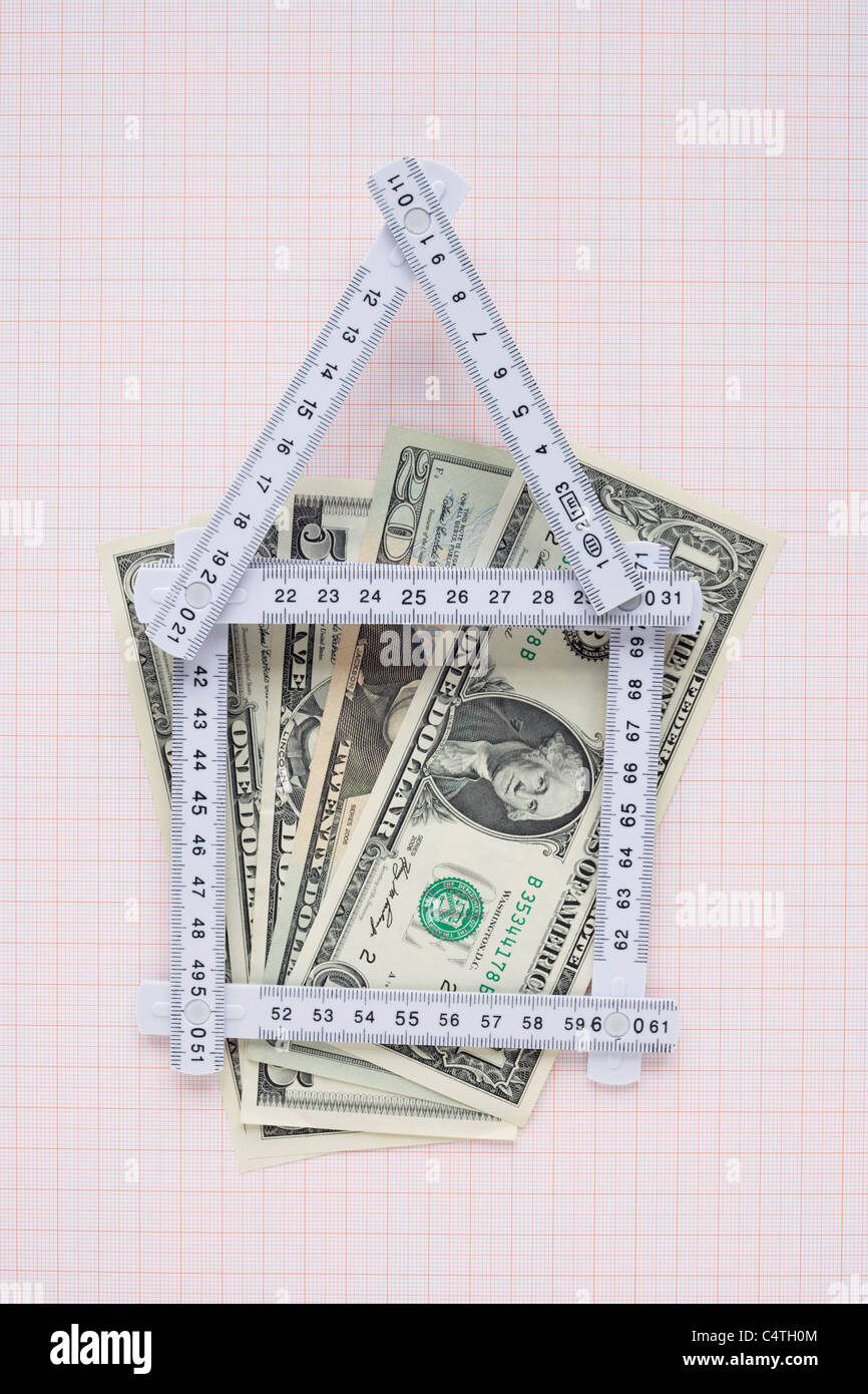House Made of Expandable Ruler and American Currency on Graph Paper ...