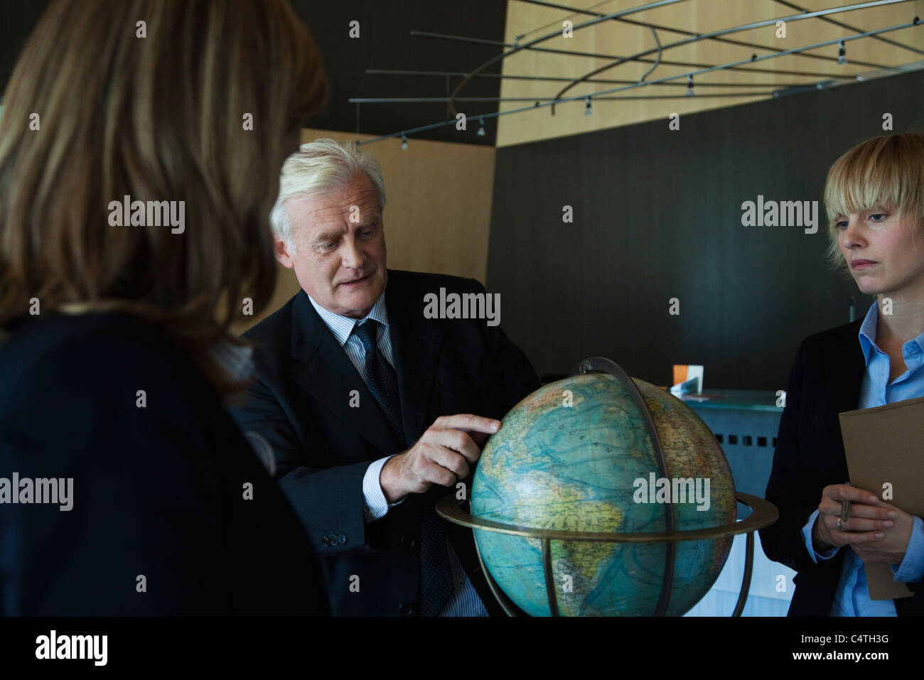 Executive outlining future global business plans to colleagues Stock ...