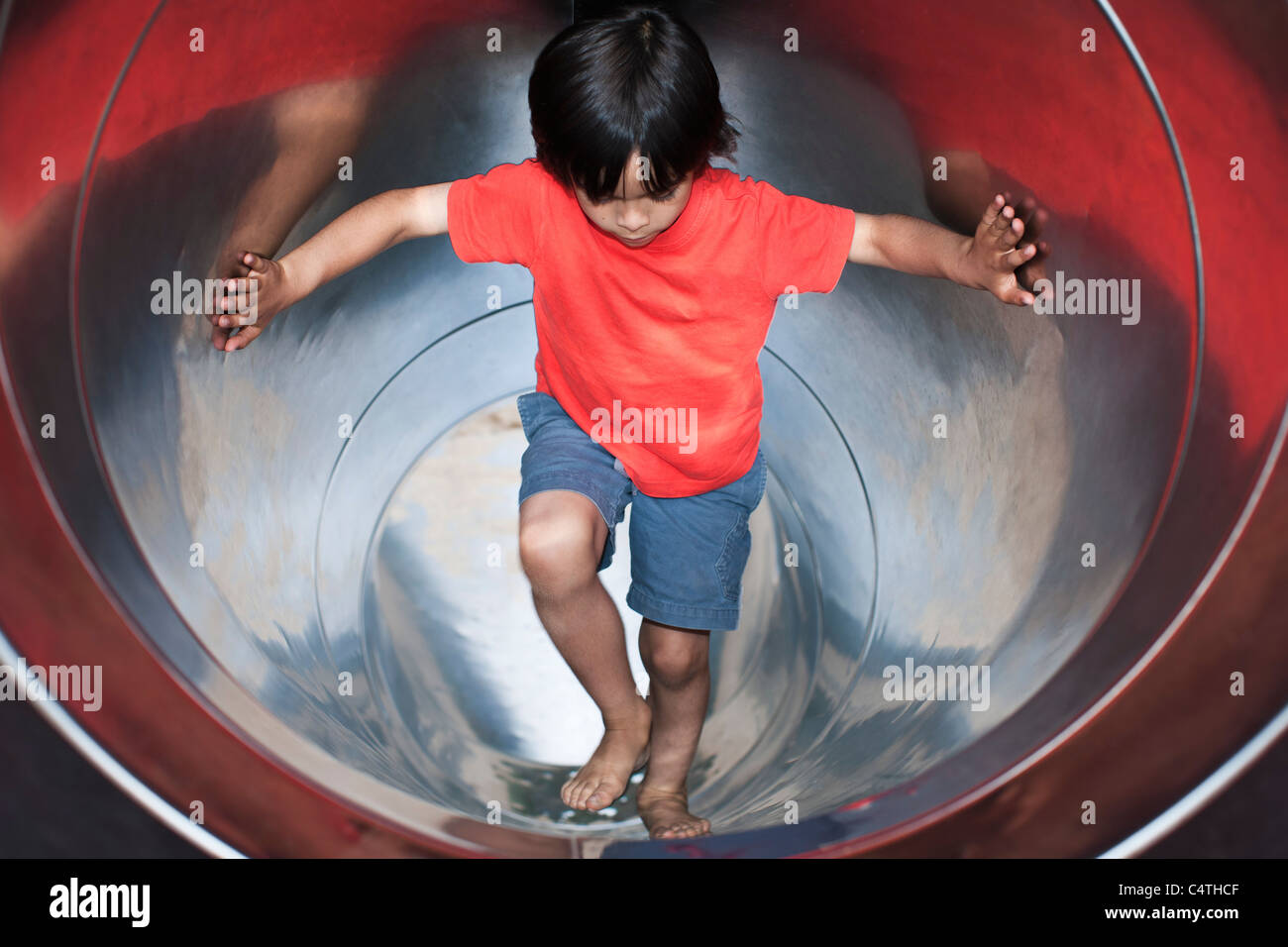 Boy Walking Up Slide Stock Photo - Alamy