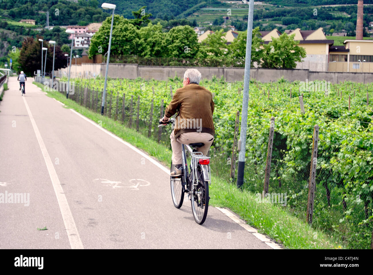 Mature man cycling country road hi-res stock photography and images - Alamy