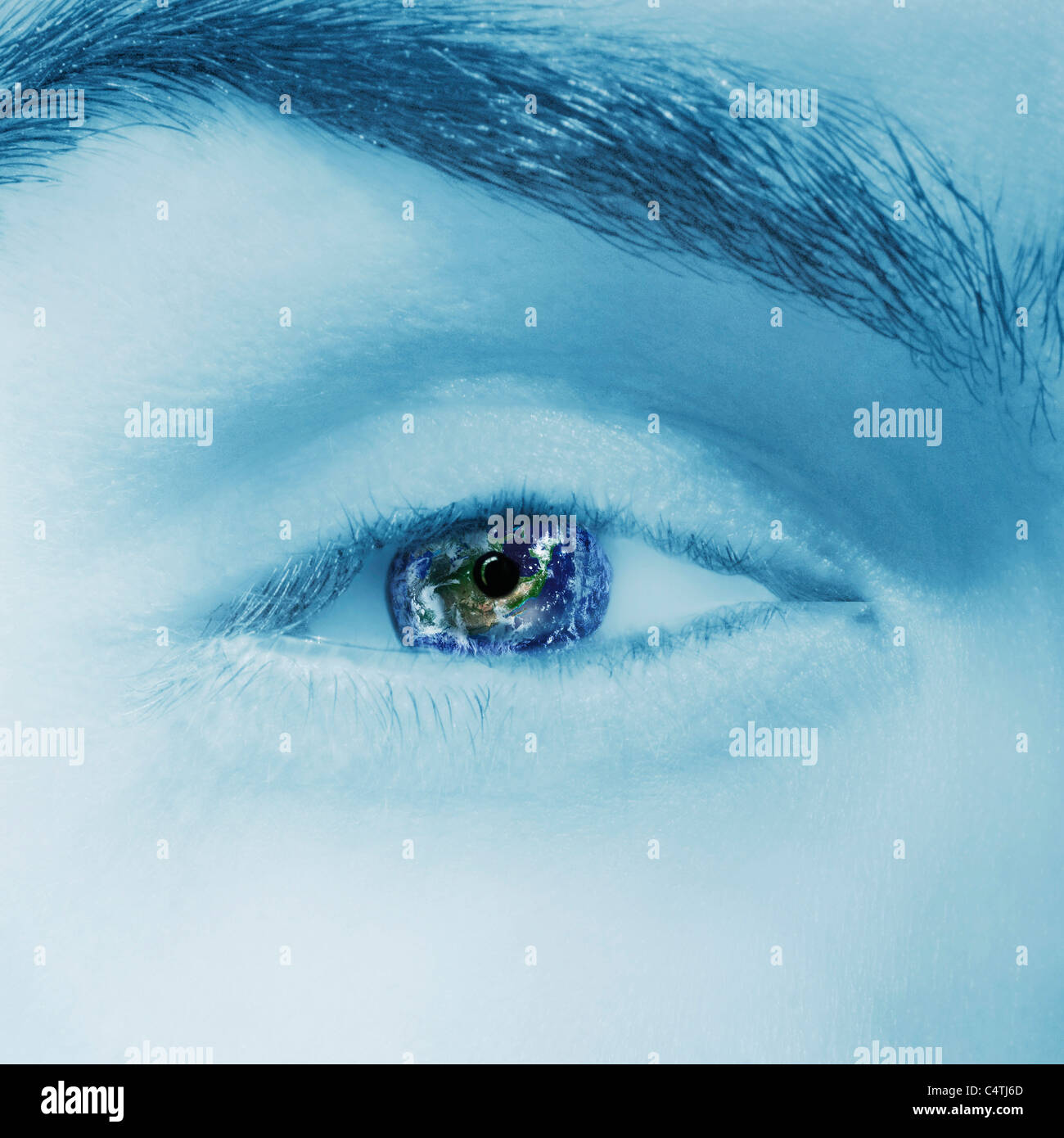 Blue scale close-up of man's eye with earth reflection Stock Photo - Alamy