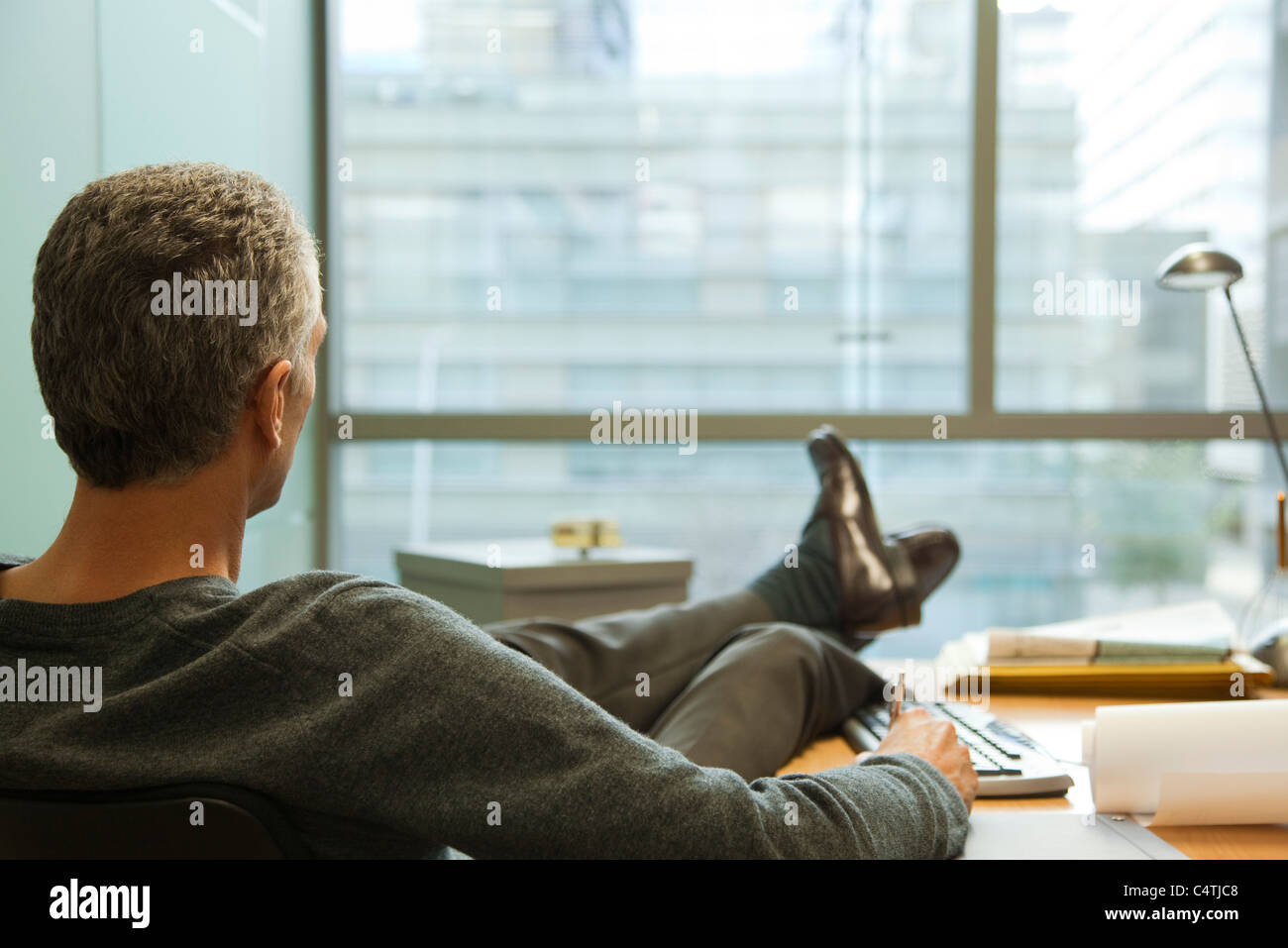 Person sitting on chair filing hi-res stock photography and images - Alamy