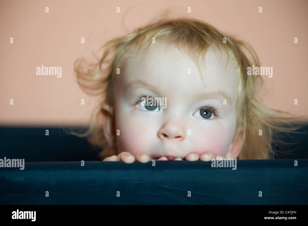 Baby peering hi-res stock photography and images - Alamy