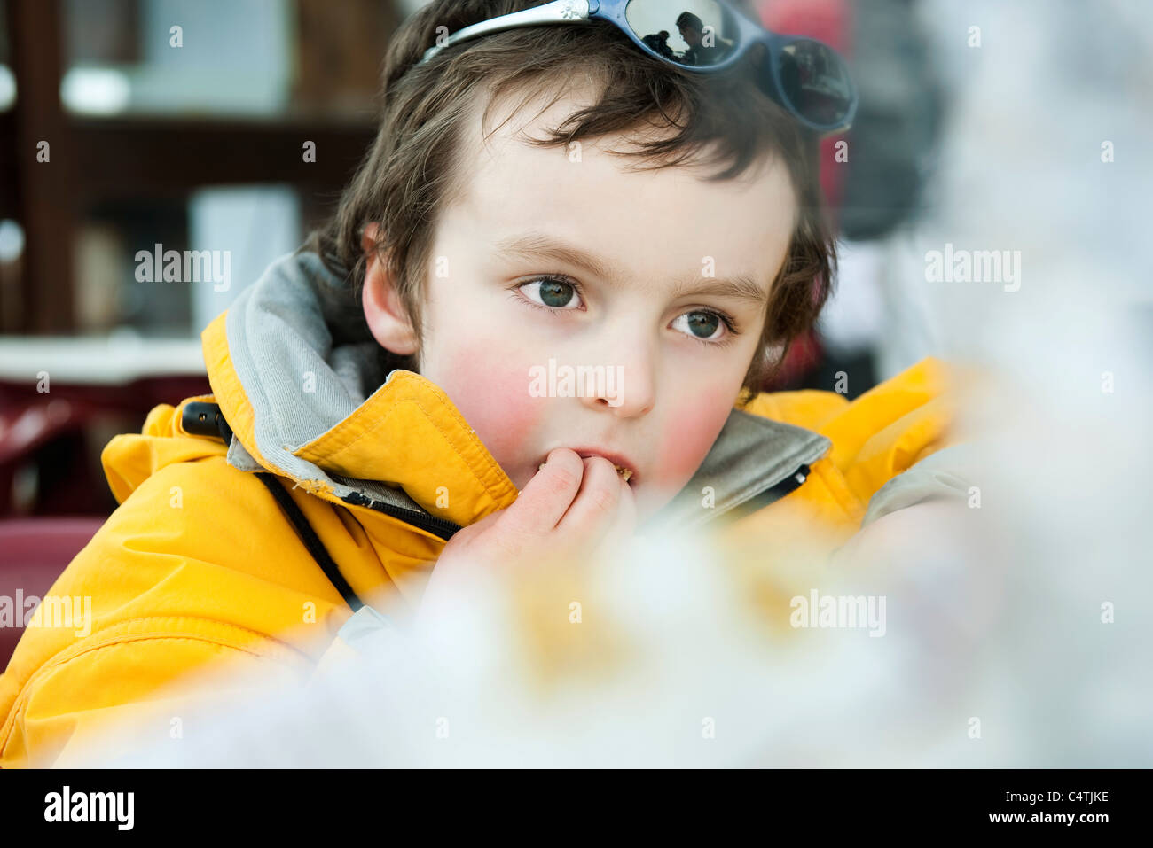 Little boy eating snack Stock Photo - Alamy