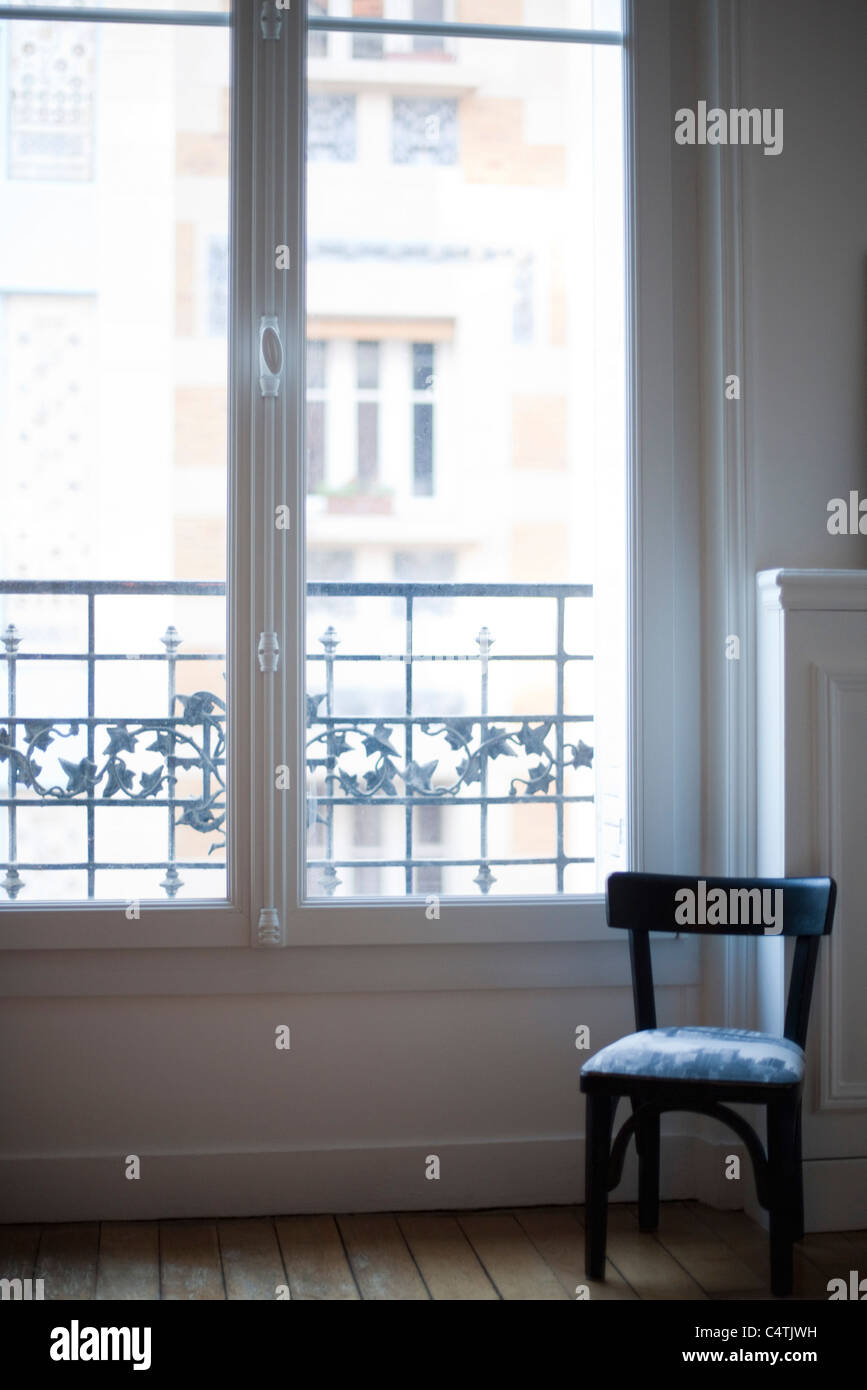 Chair by window Stock Photo - Alamy