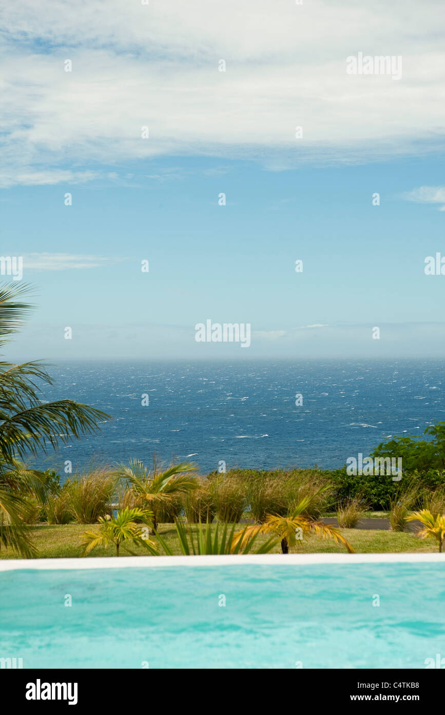 Swimming pool with view of sea at resort Stock Photo - Alamy