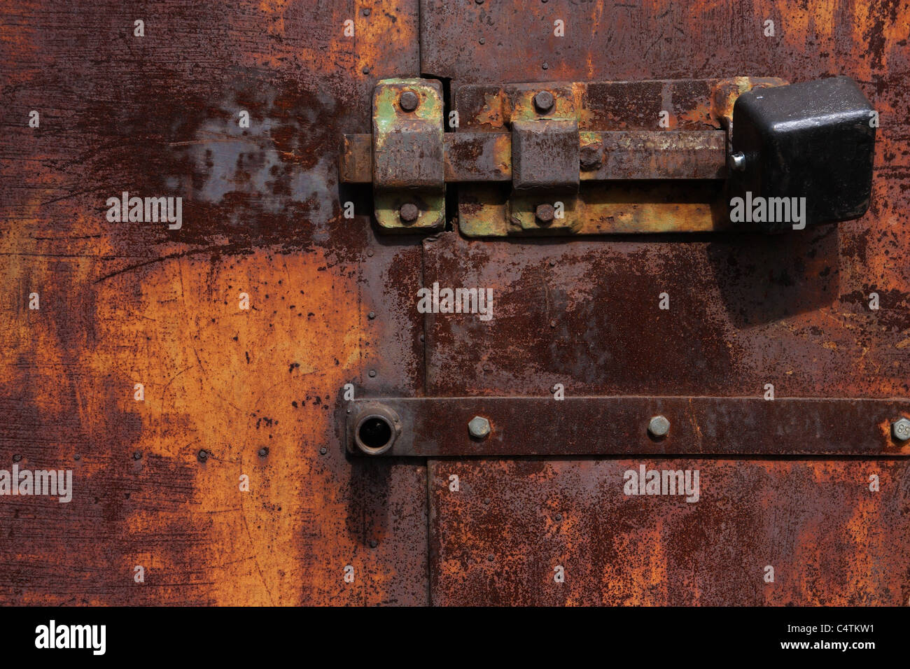 Rusty gate with lock Stock Photo - Alamy