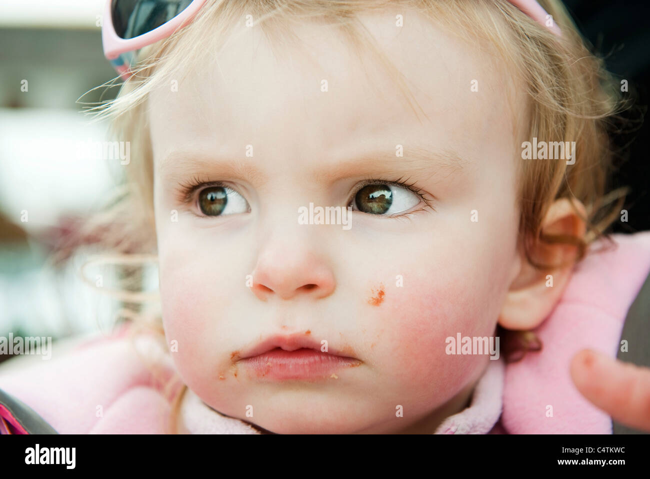 Baby girl with messy face, portrait Stock Photo - Alamy