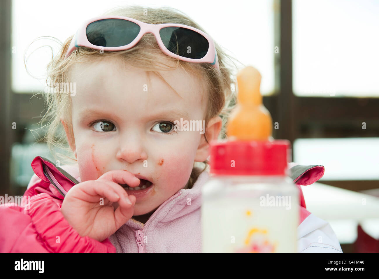 Baby girl with messy face, portrait Stock Photo - Alamy