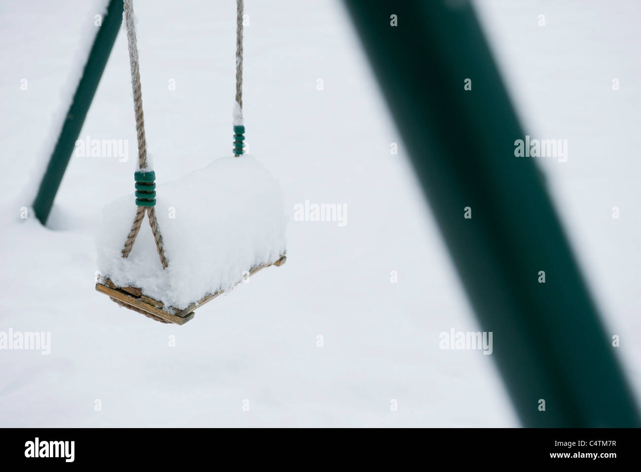 Empty swings snow hi-res stock photography and images - Alamy