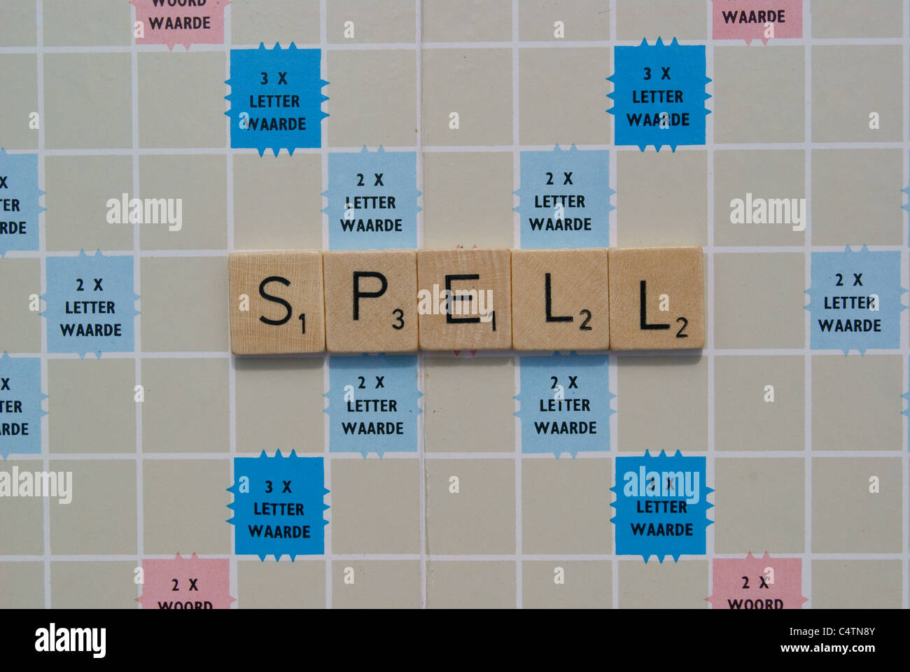 spell, spelled by scrabble letters Stock Photo - Alamy
