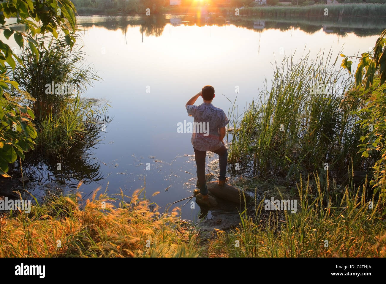 Man by the river Stock Photo - Alamy