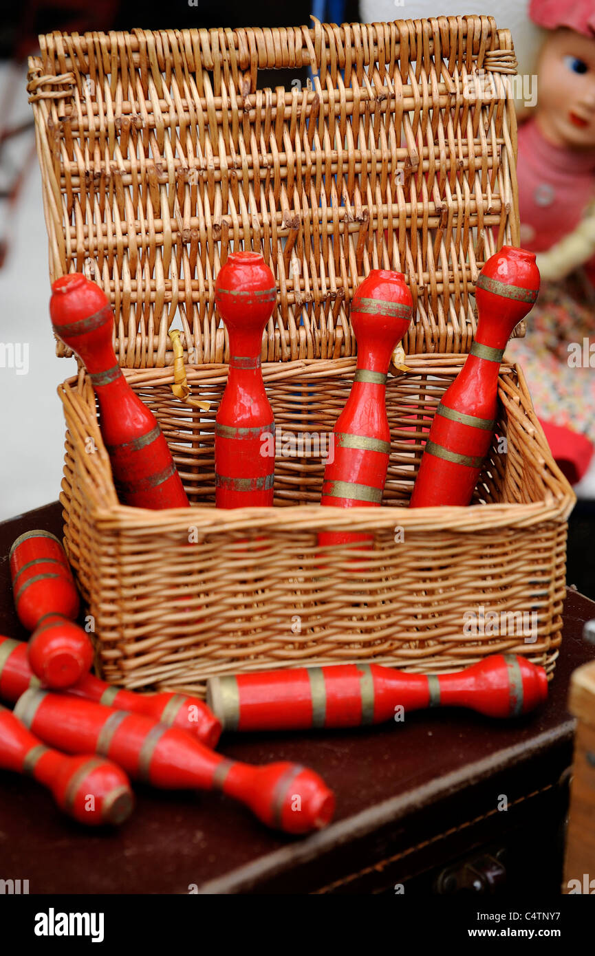 old red wooden skittles in a wicker basket england uk Stock Photo - Alamy