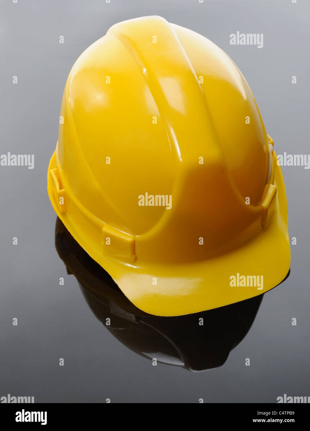 Yellow hard hat Stock Photo - Alamy