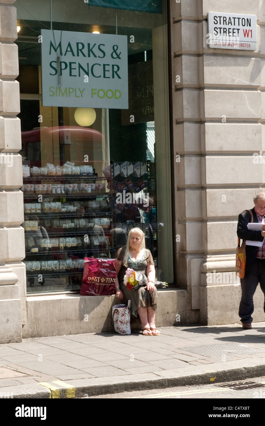 London , Mayfair , Stratton Street , blond woman or lady sitting with ...