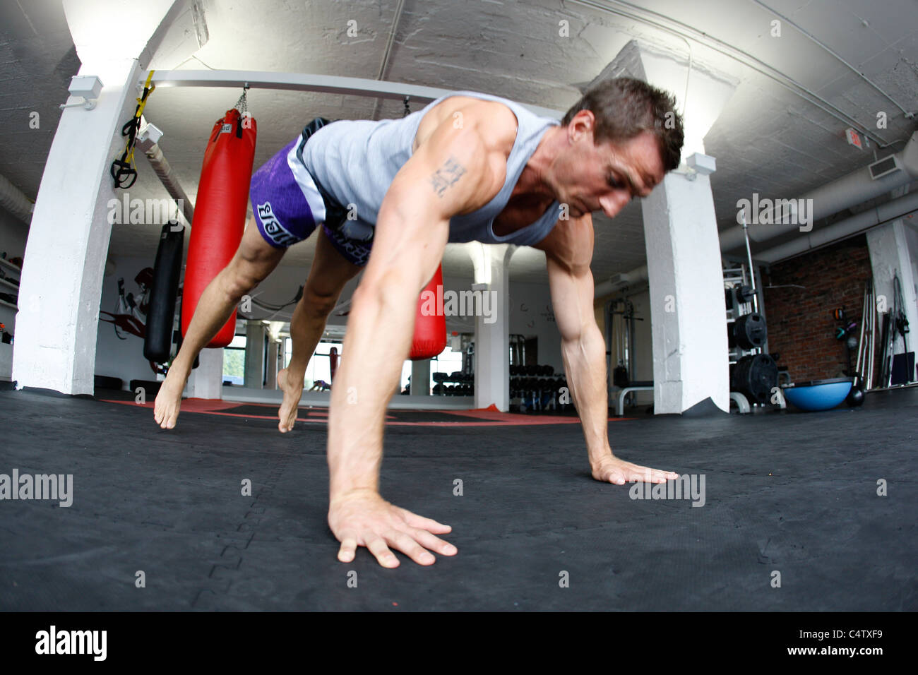 male doing jump push ups Stock Photo - Alamy