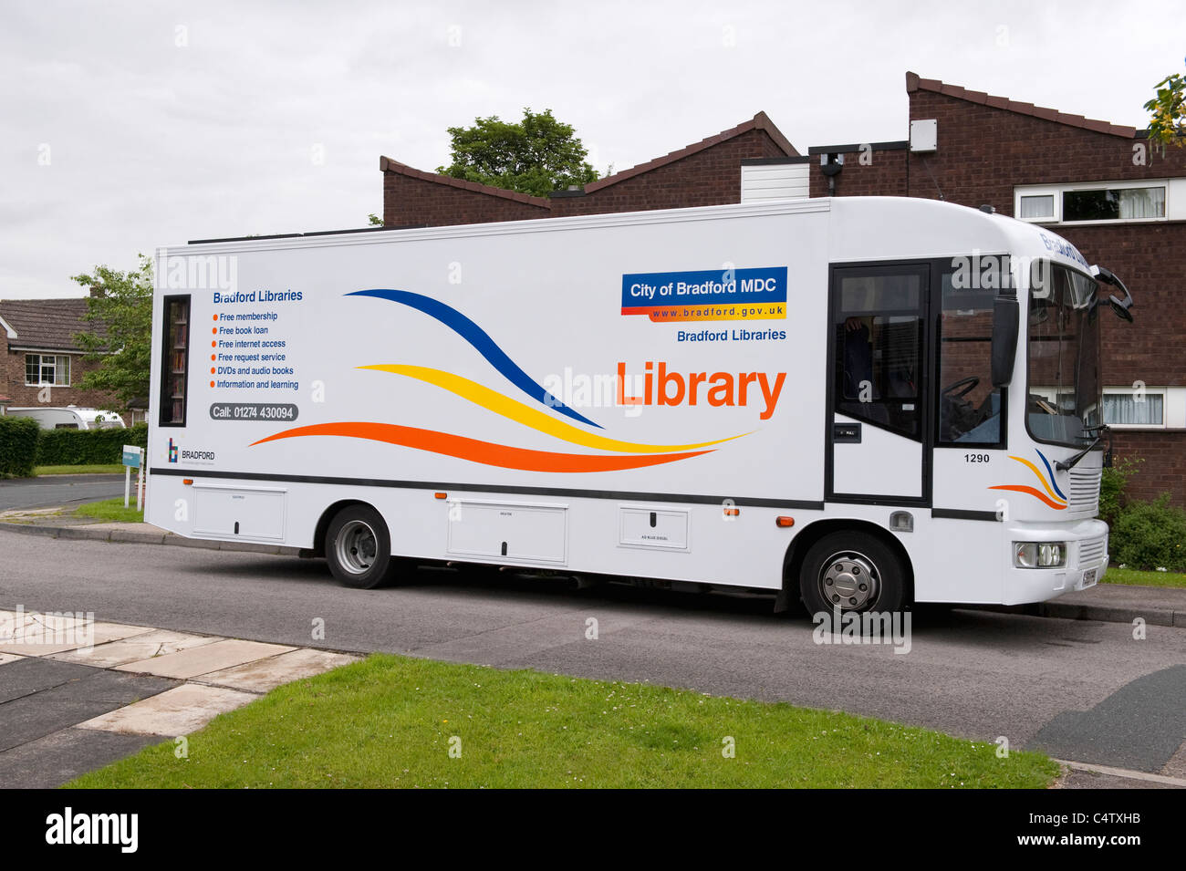 Mobile library van lorry parked by residential retirement houses ...