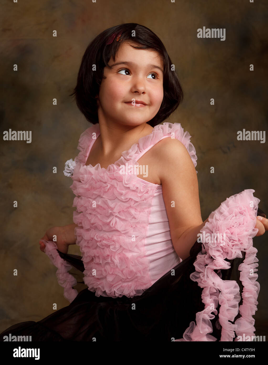 Young 10 years old Caucasian girl dancing and playing in the studio ...