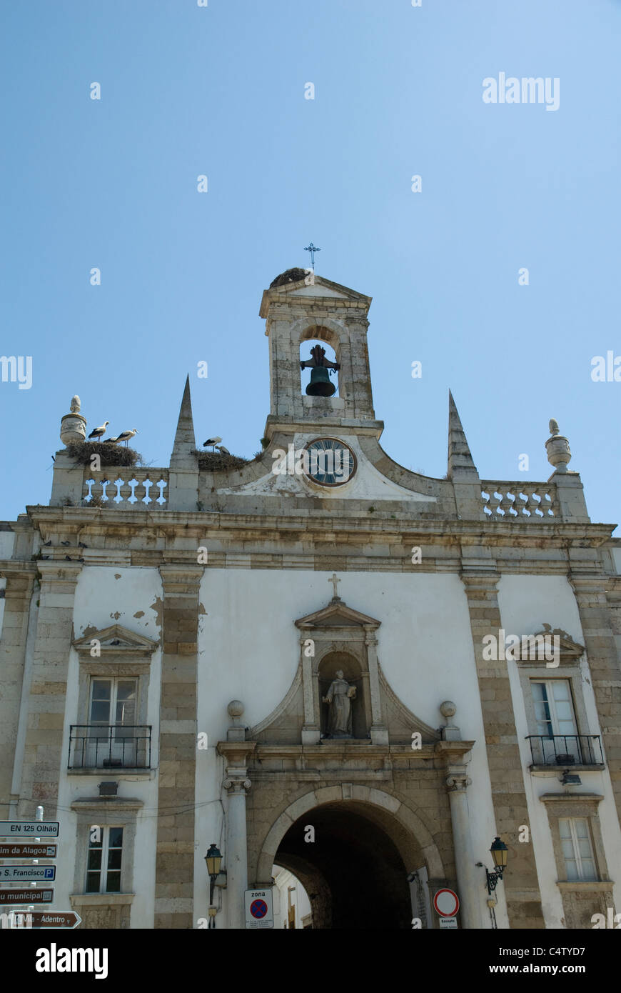 White storks nesting on a historic building in the town of Faro ...