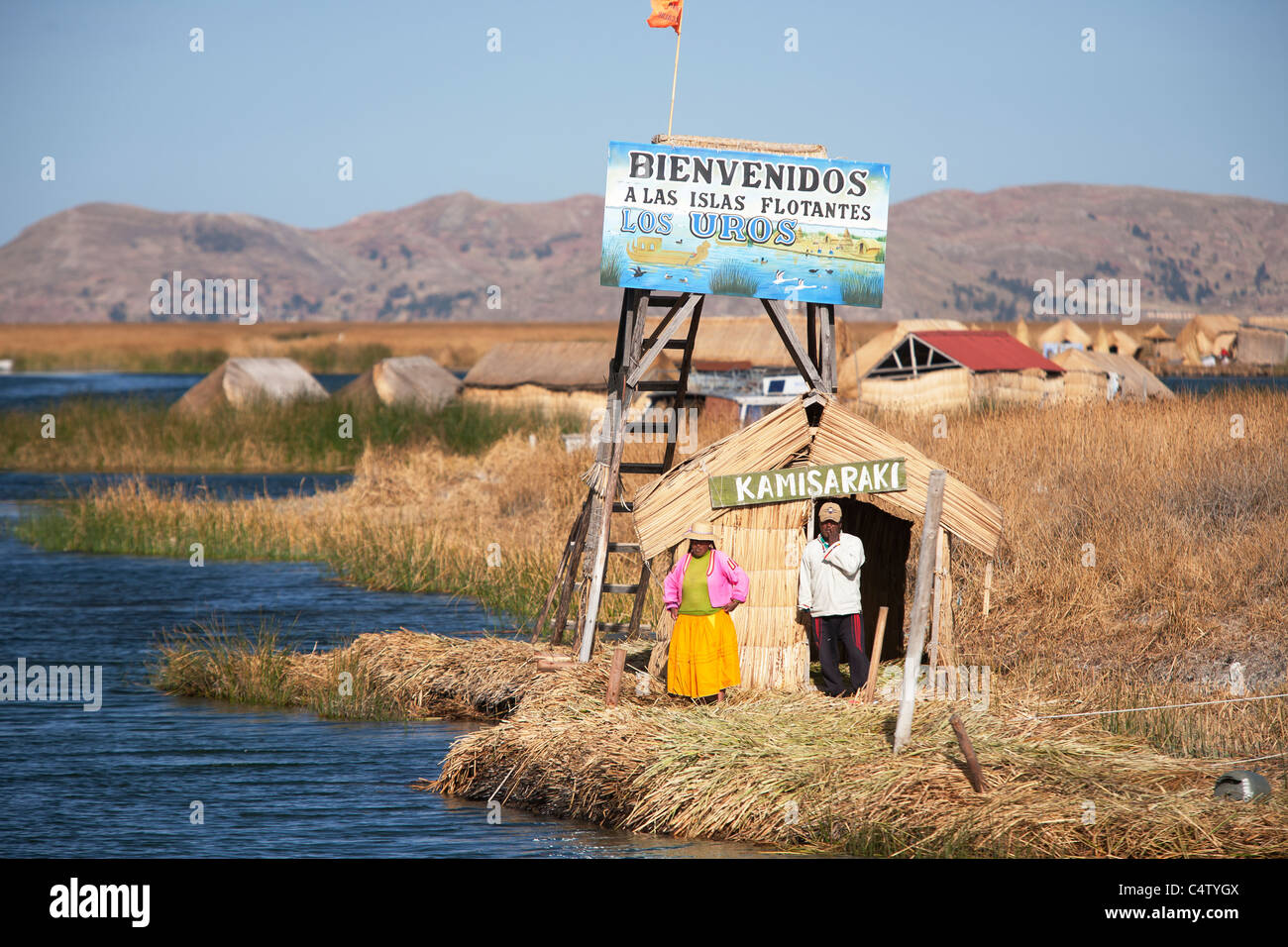 A hut and sign marks the entrance to the Uros floating islands. The ...