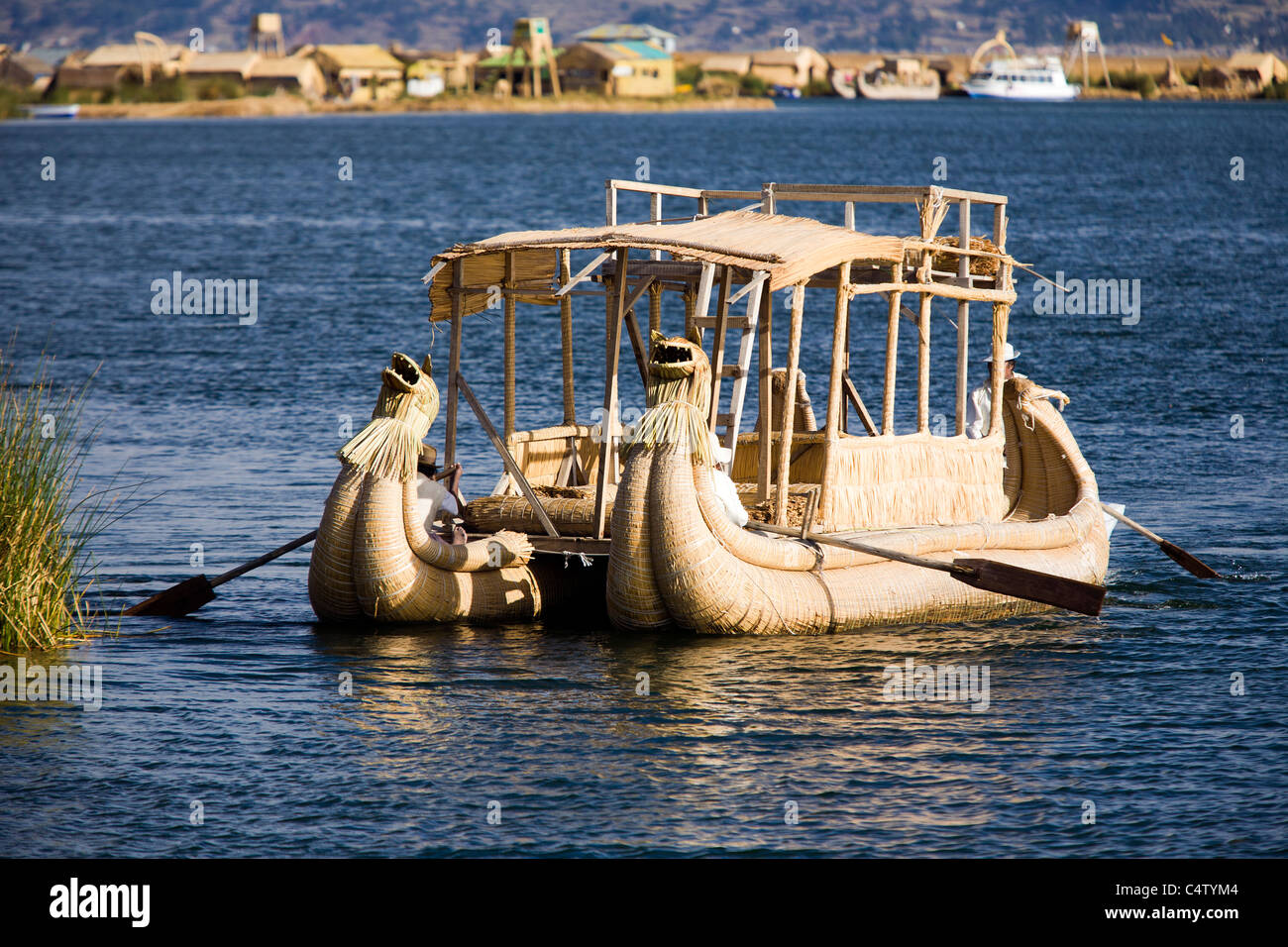 A traditional Uros boat of the Quechua people on Lake Titicaca Stock ...