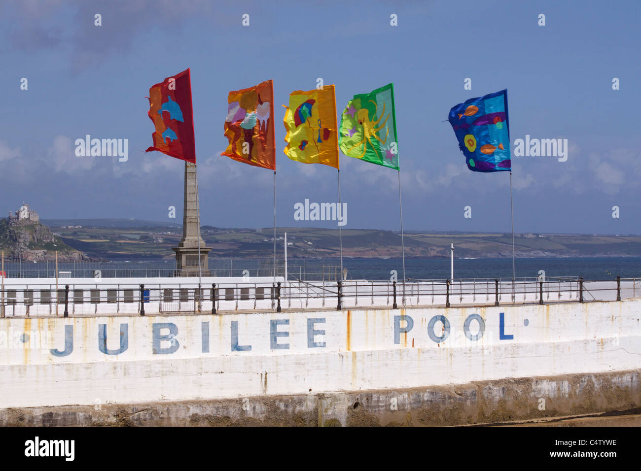 Brightly coloured flags blowing in the breeze above the Jubilee Pool ...