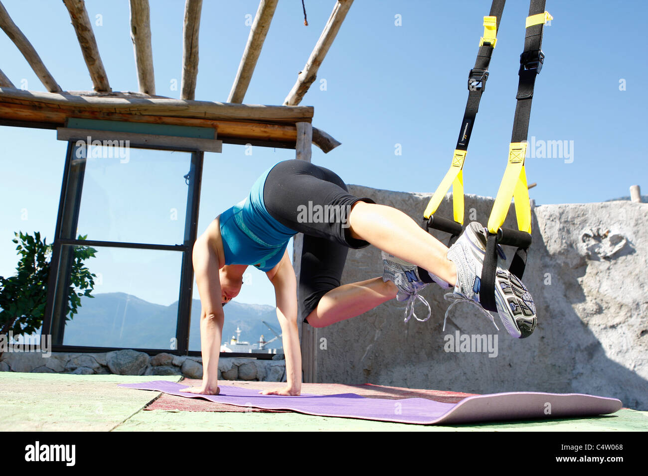 Woman training outside trx hi-res stock photography and images - Alamy